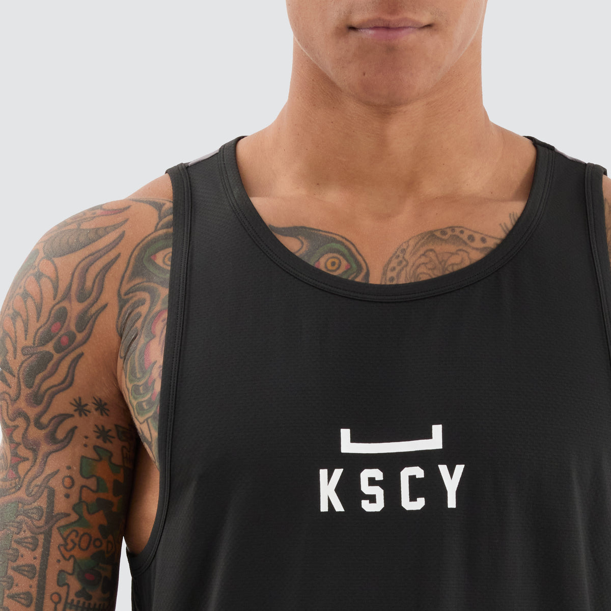KSCY ACTIVEWEAR - Bolster Curved Hem Tank in Black/Grey | Neverland Store
